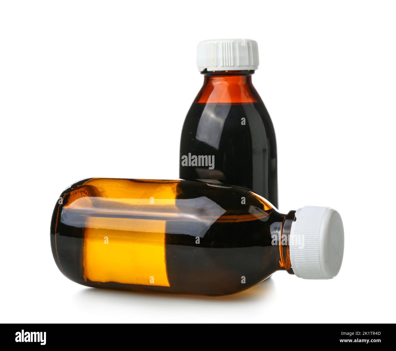 Bottles of cough syrup on white background Stock Photo - Alamy
