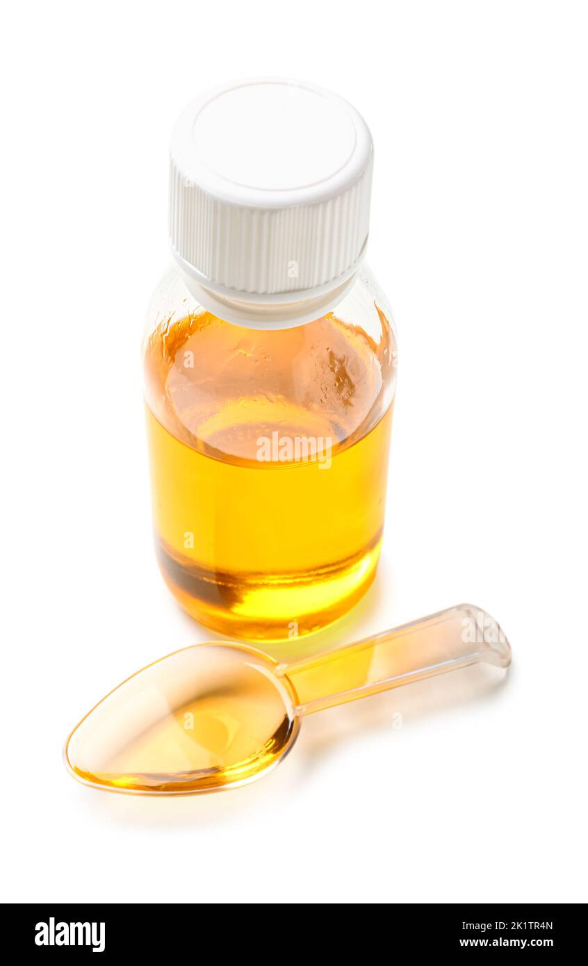 Bottle of cough syrup and spoon on white background Stock Photo - Alamy