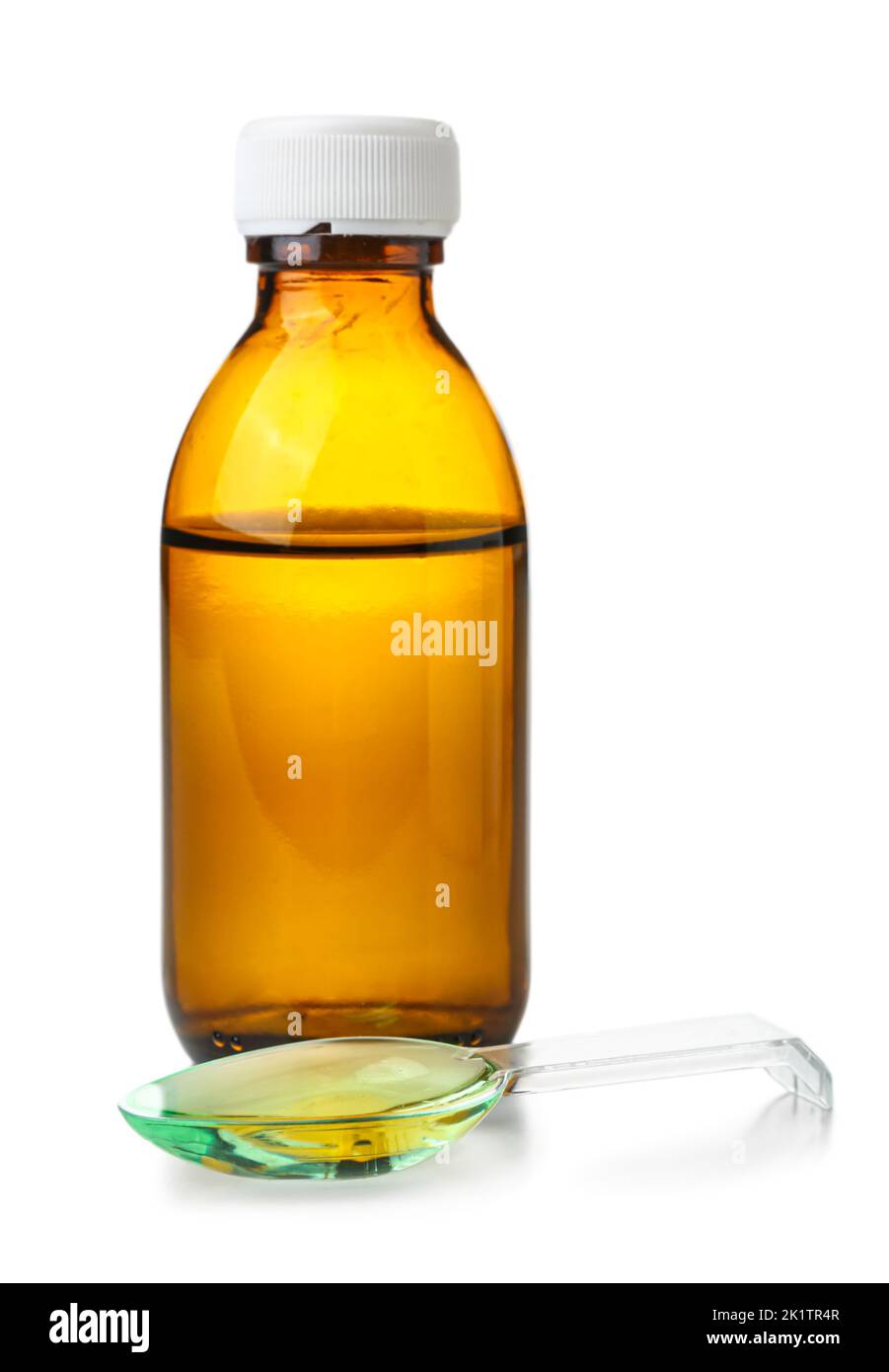 Bottle of cough syrup and spoon on white background Stock Photo - Alamy