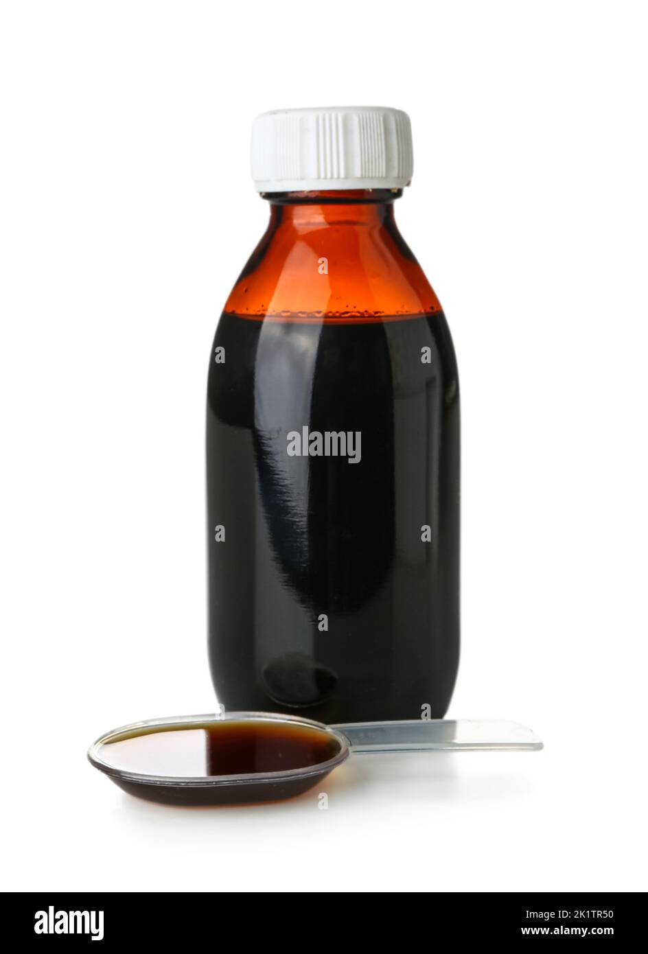 Bottle of cough syrup and spoon on white background Stock Photo - Alamy