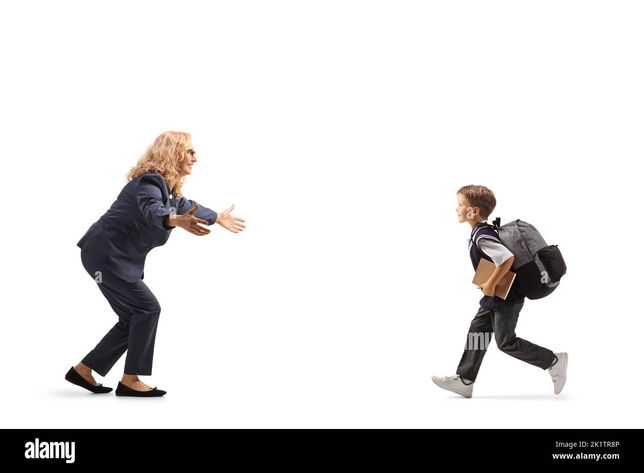 Schoolboy with backpack running to hug his mother isolated on white ...