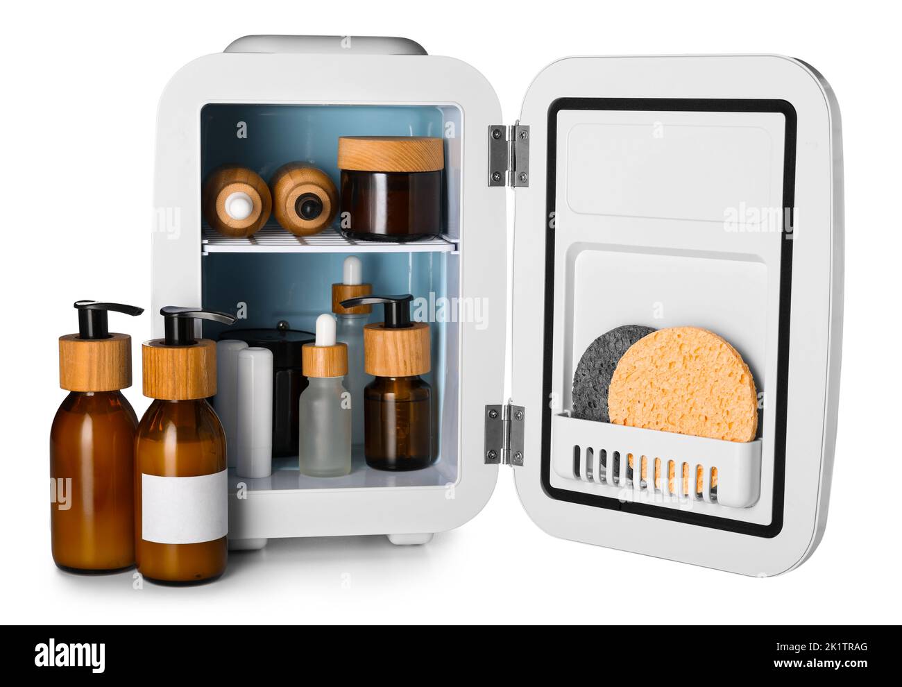 Small refrigerator with cosmetic products on white background Stock ...