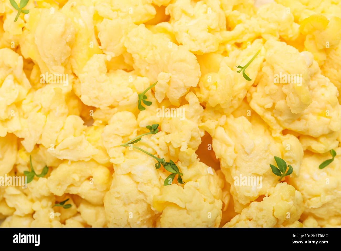 Texture of tasty scrambled eggs as background, closeup Stock Photo - Alamy