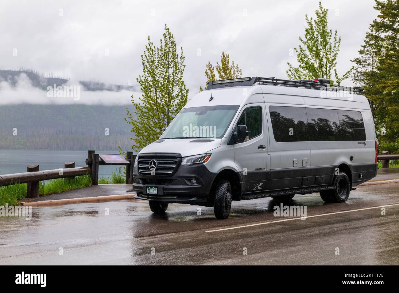 Airstream Interstate 24X campervan; stormy skies over Lake McDonald ...