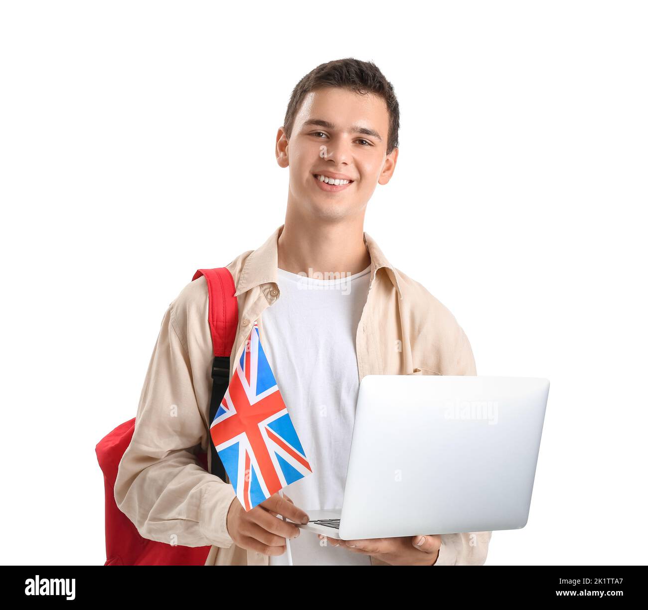 Teenage boy with UK flag, backpack and laptop on white background Stock ...