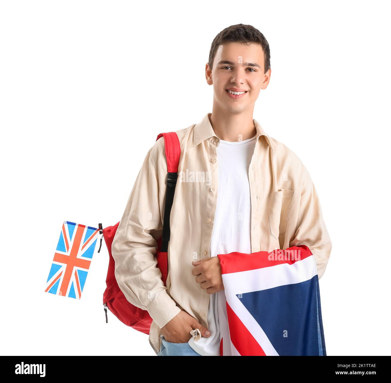 Teenage boy with UK flags and backpack on white background Stock Photo ...