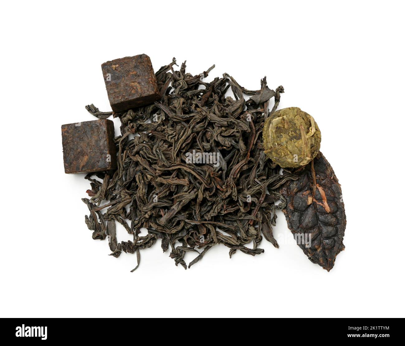 Dry pressed puer tea on white background Stock Photo - Alamy