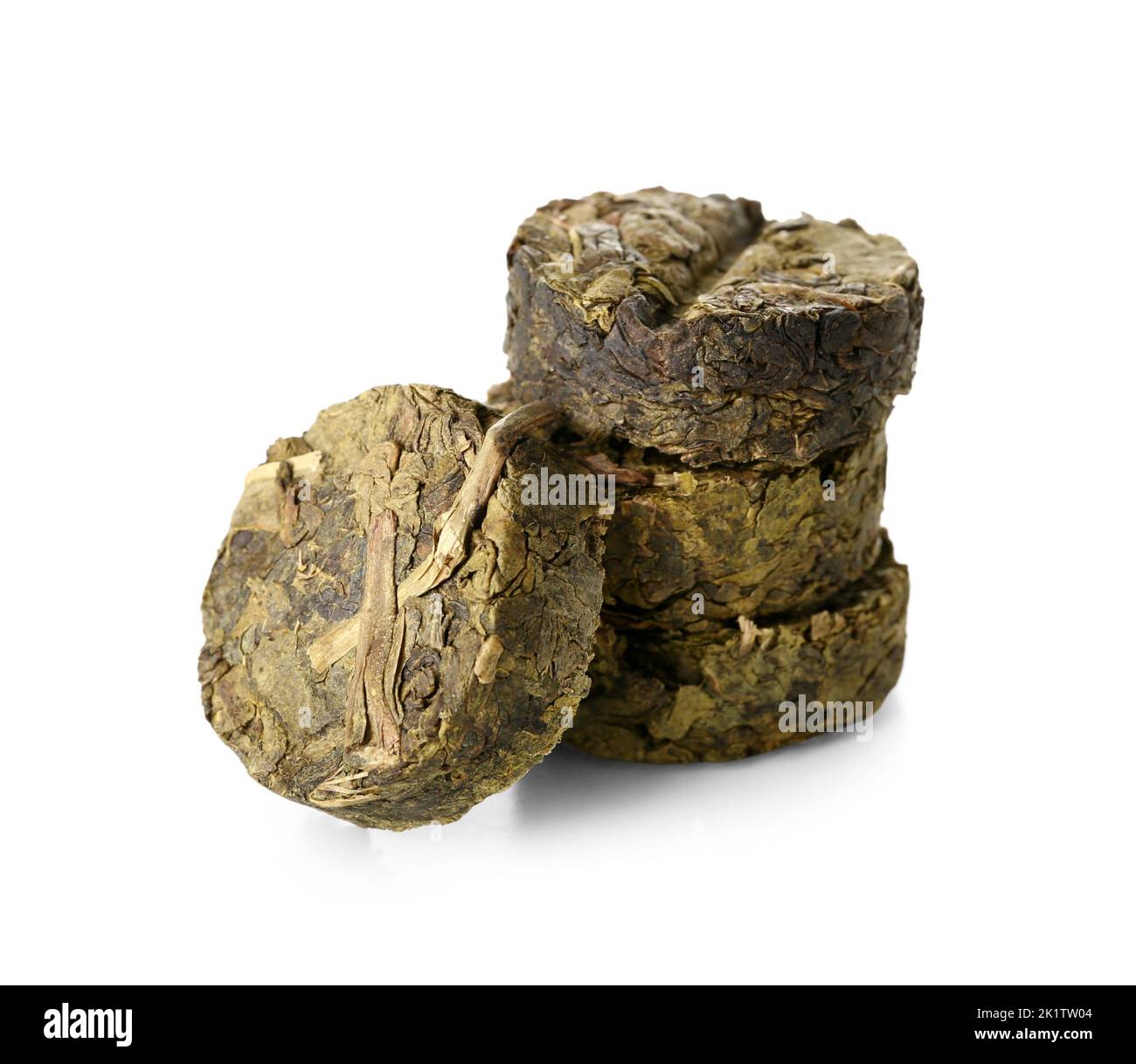 Dry pressed puer tea on white background Stock Photo - Alamy