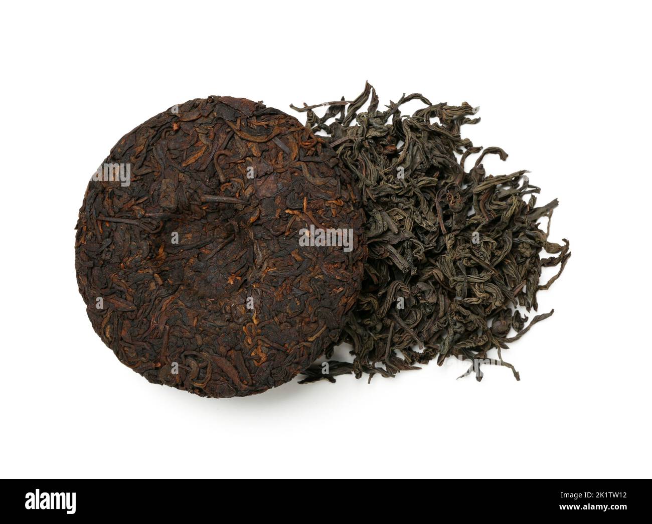 Dry pressed puer tea on white background Stock Photo - Alamy