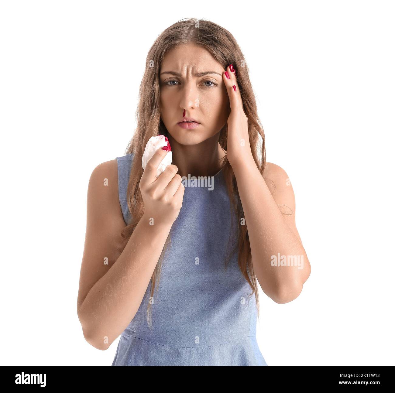 Young woman with nosebleed and tissue on white background Stock Photo ...