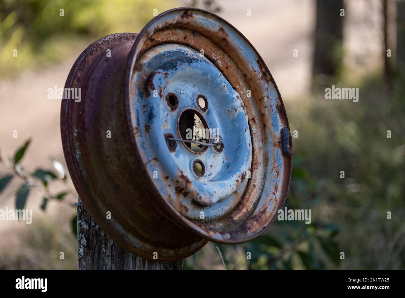 An old rusty stamped steel wheel Stock Photo - Alamy