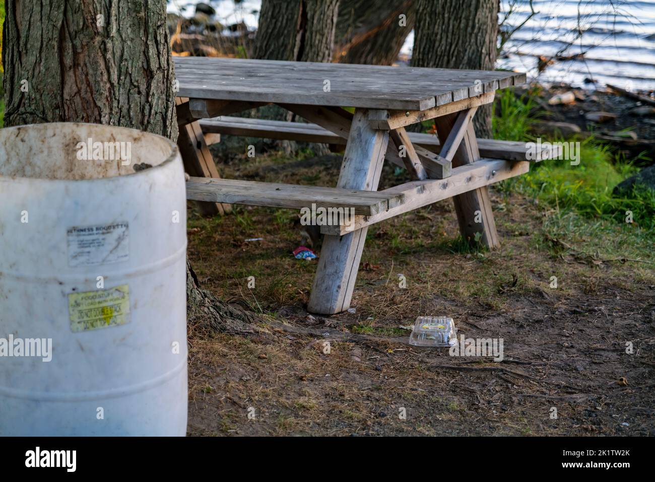 White plastic barrel for garbage in a park near Rockland Lake, New York ...