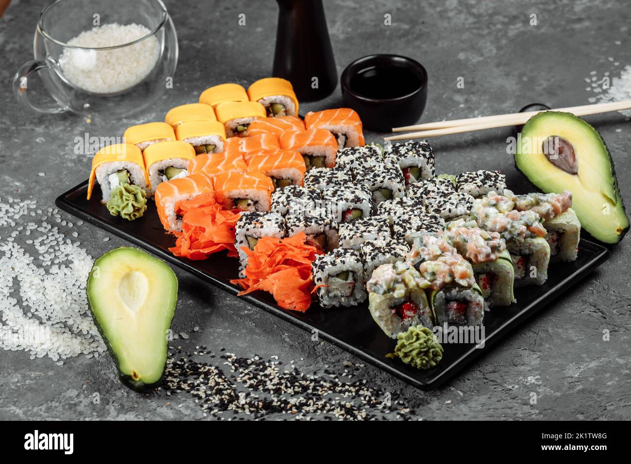 Sushi set with fresh ingredients on gray background. Sushi menu ...