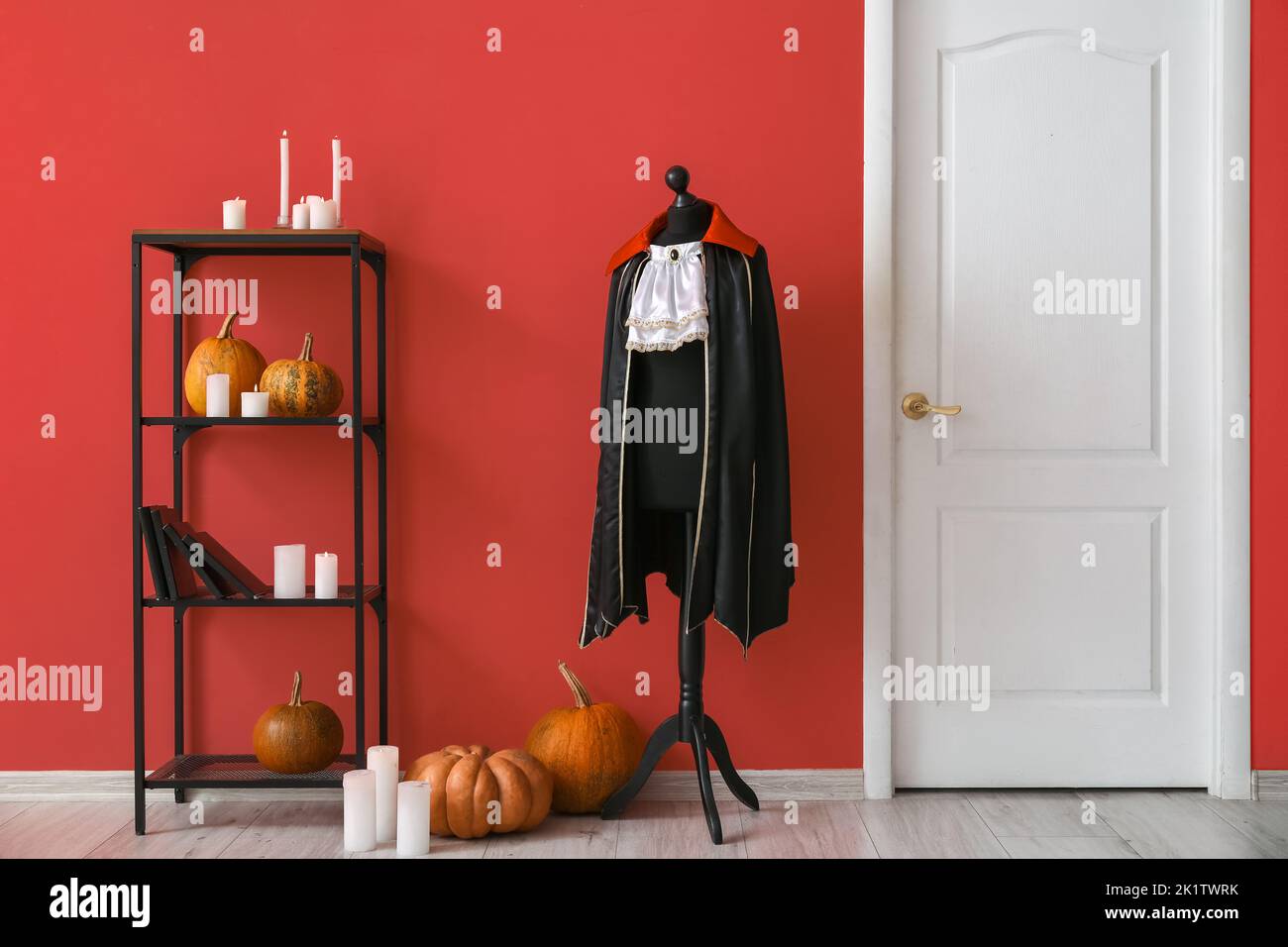 Interior of hall with shelving unit, vampire costume and Halloween ...