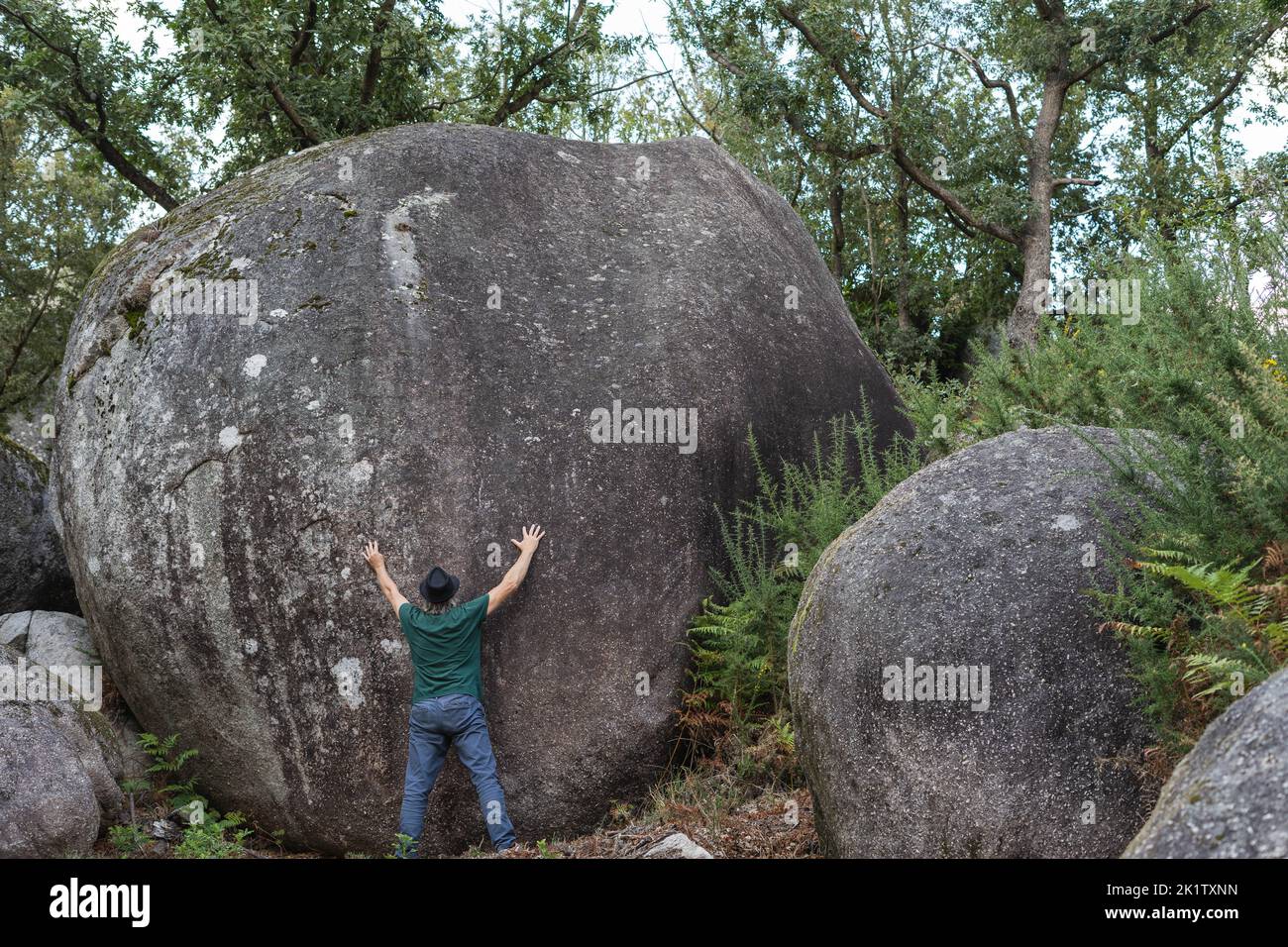 man and stone Stock Photo - Alamy