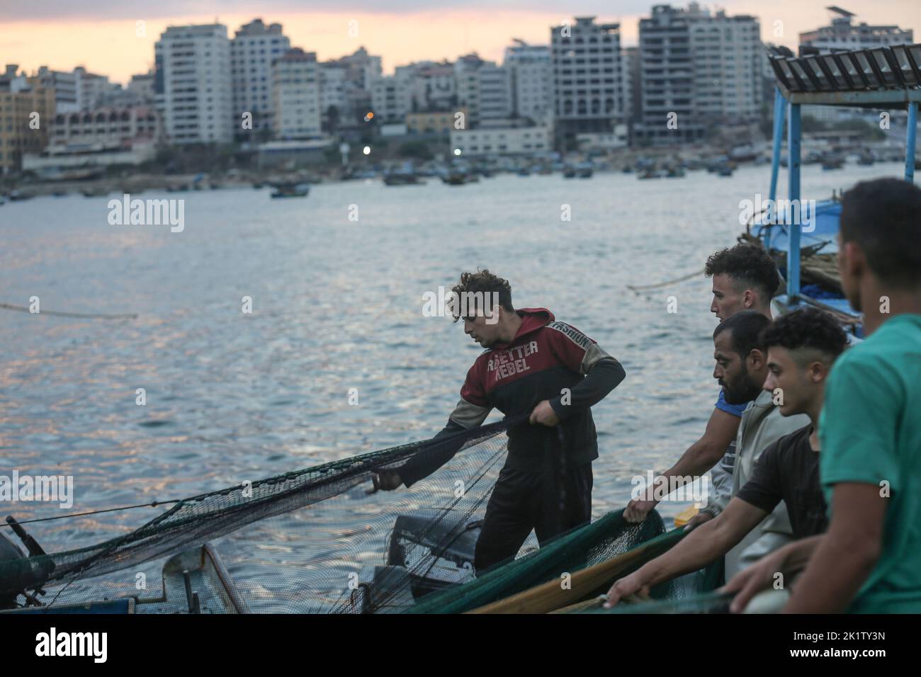 Gaza, Palestine. 20th Sep, 2022. Palestinian fishermen pull their ...