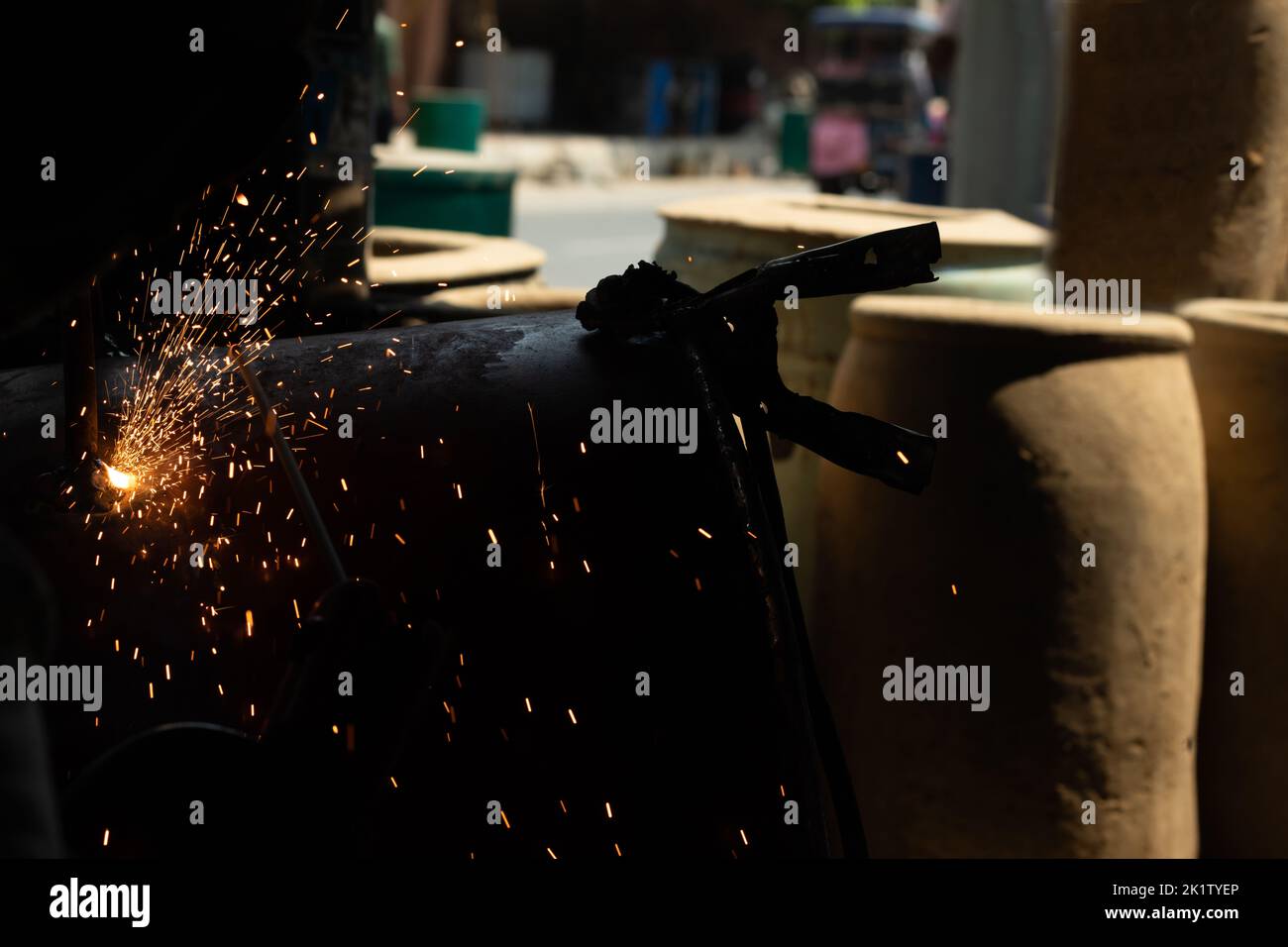 Skilled Worker Does Welding On Metal Tin Drum While Making Traditional ...