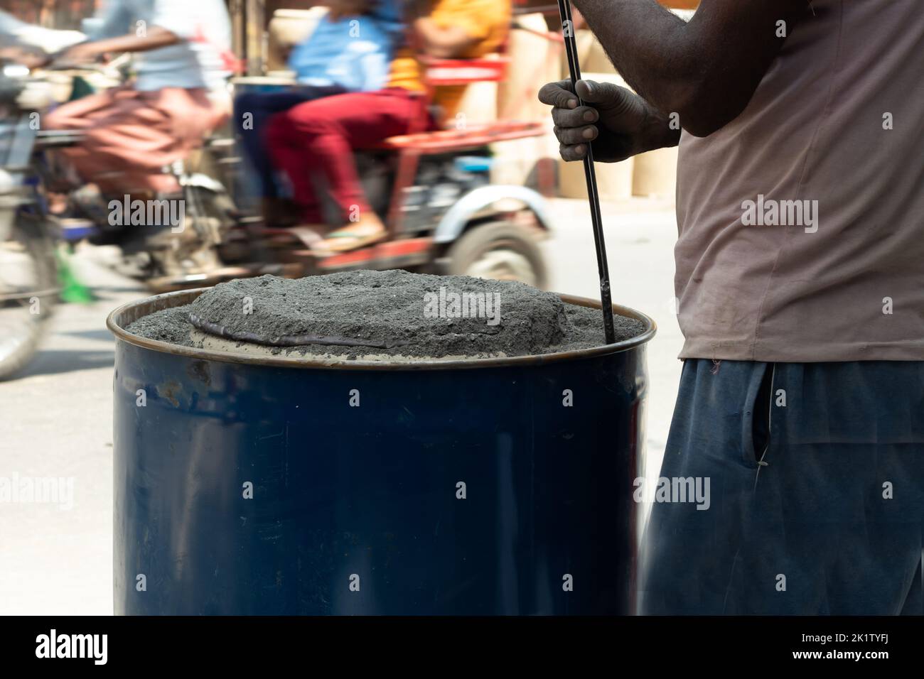 Skilled Worker Filling Or Packaging Gravel Or Pearl Millet Bajri While ...