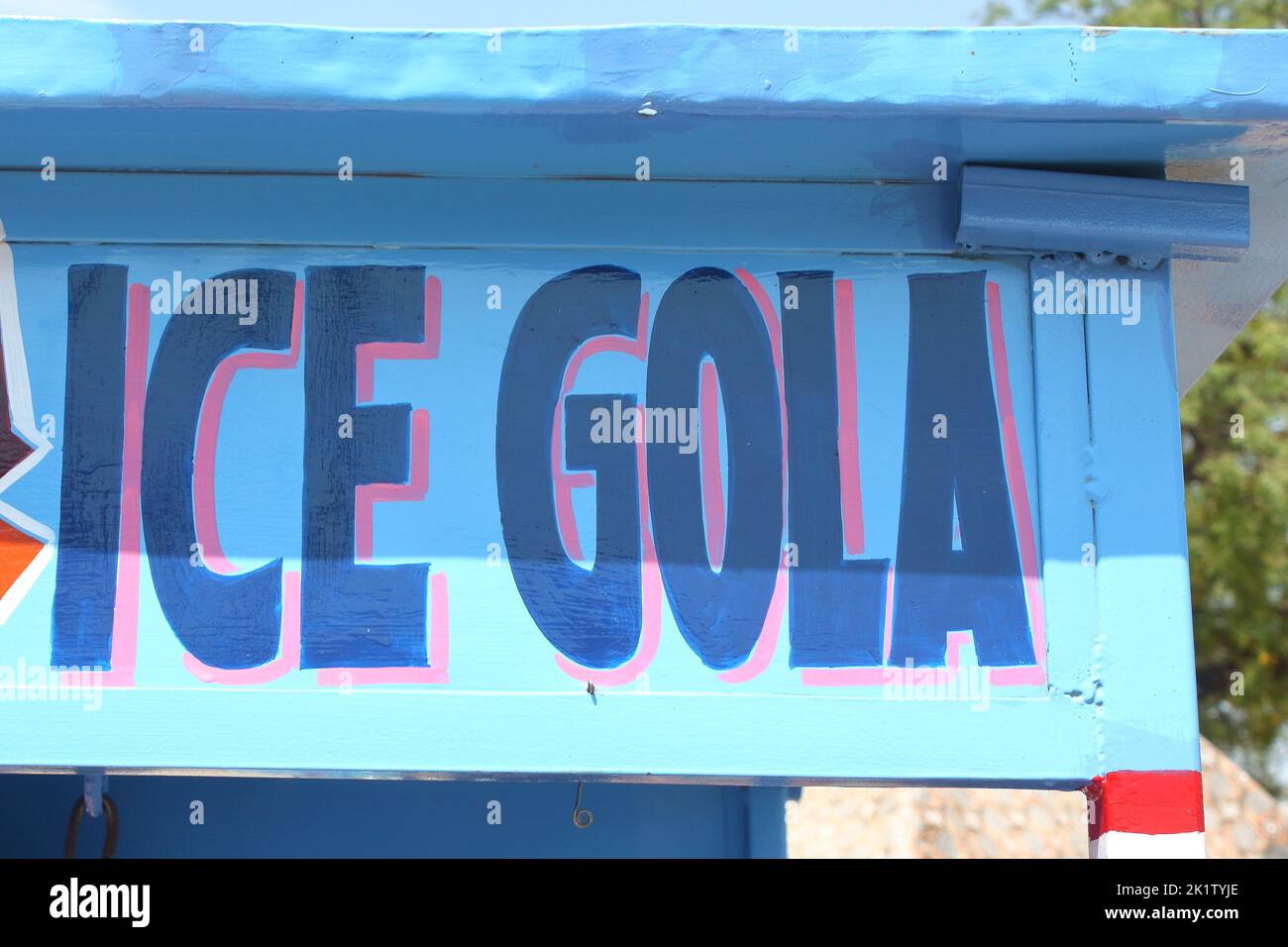 the inscription, sign of ice gola - ice cream on a stand in the Indian ...
