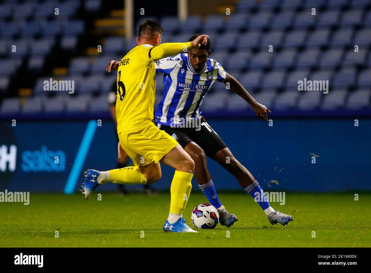 Tyreeq Bakinson #19 of Sheffield Wednesday and Calum Butcher #6 of ...