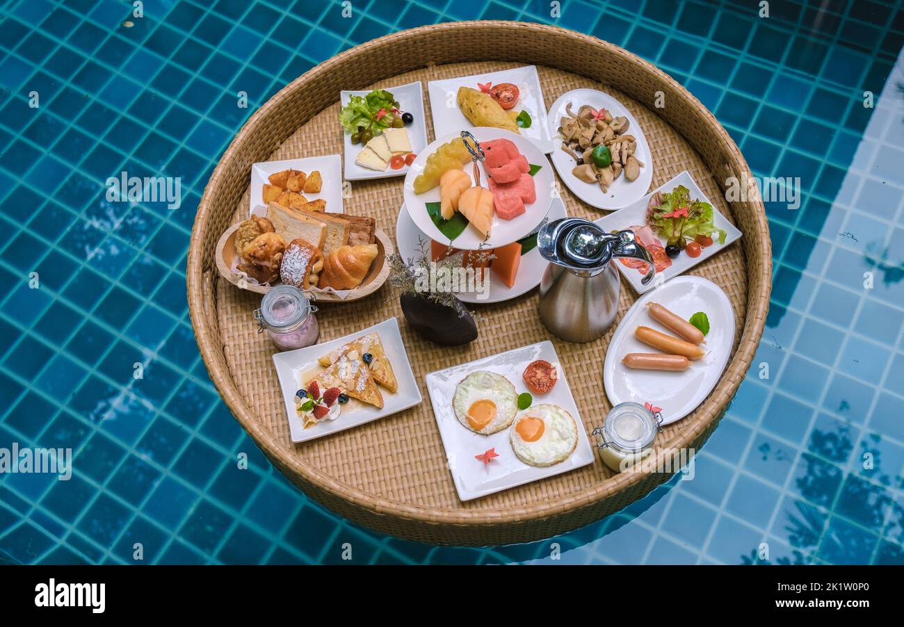 Top view of floating breakfast in the swimming pool, floating breakfast ...