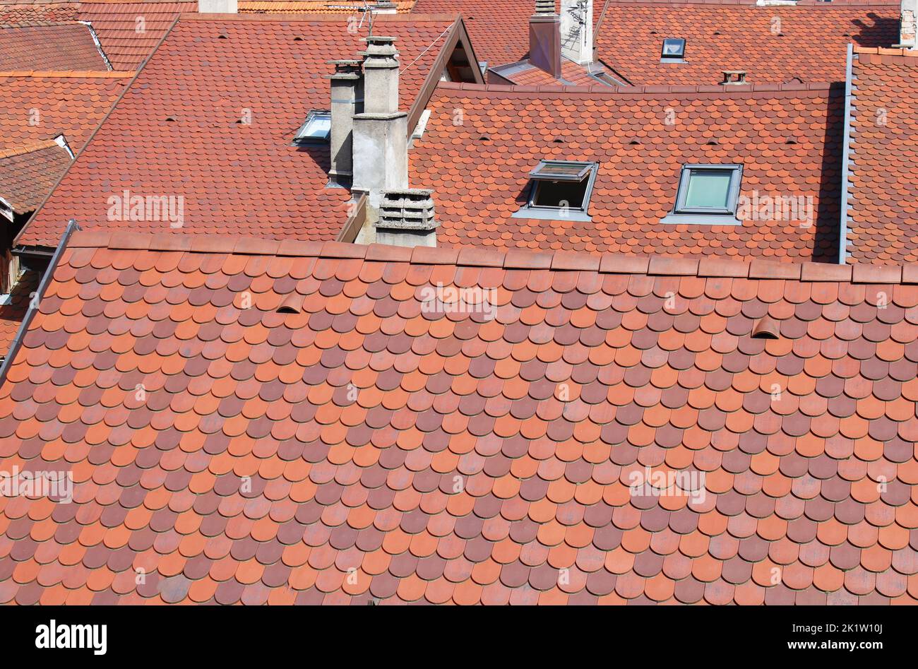 Close up detail of town house rooftops with chimneys and windows Stock ...