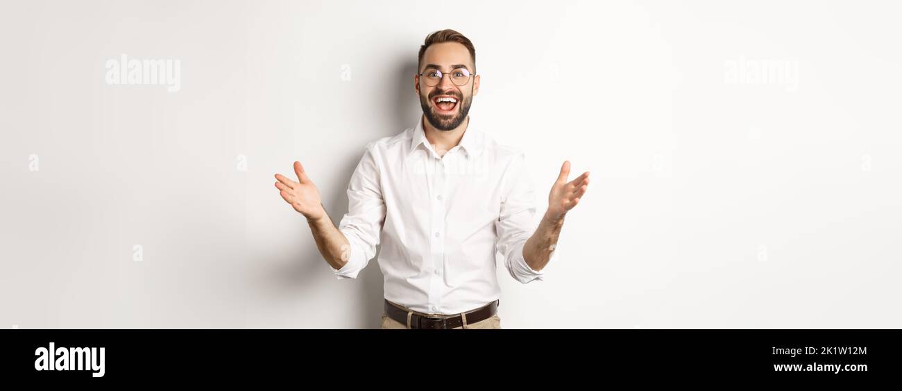 Surprised and happy businessman welcome you, looking excited and ...
