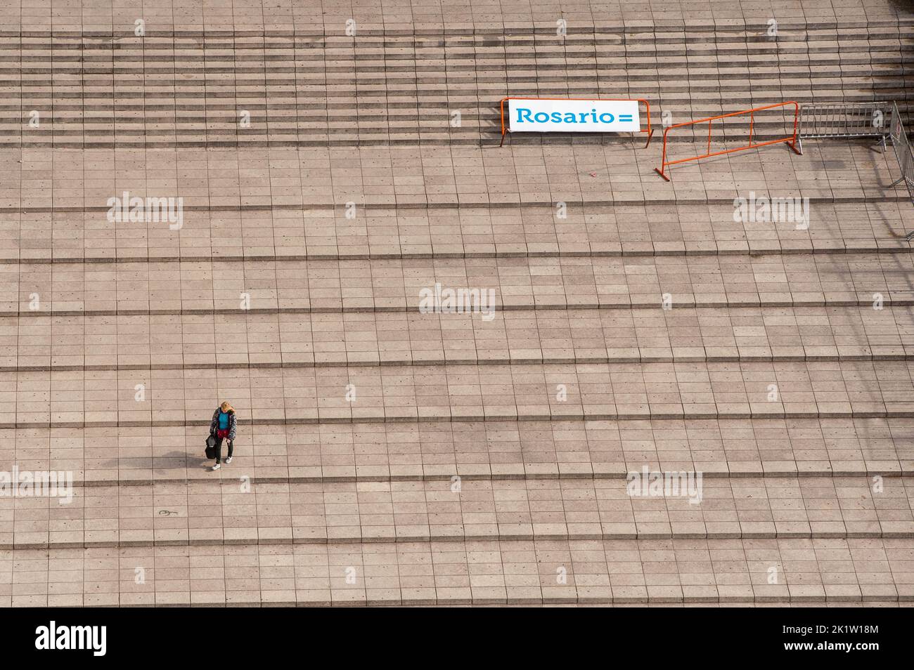 A person walking down the stairs of the National Flag Memorial and a ...