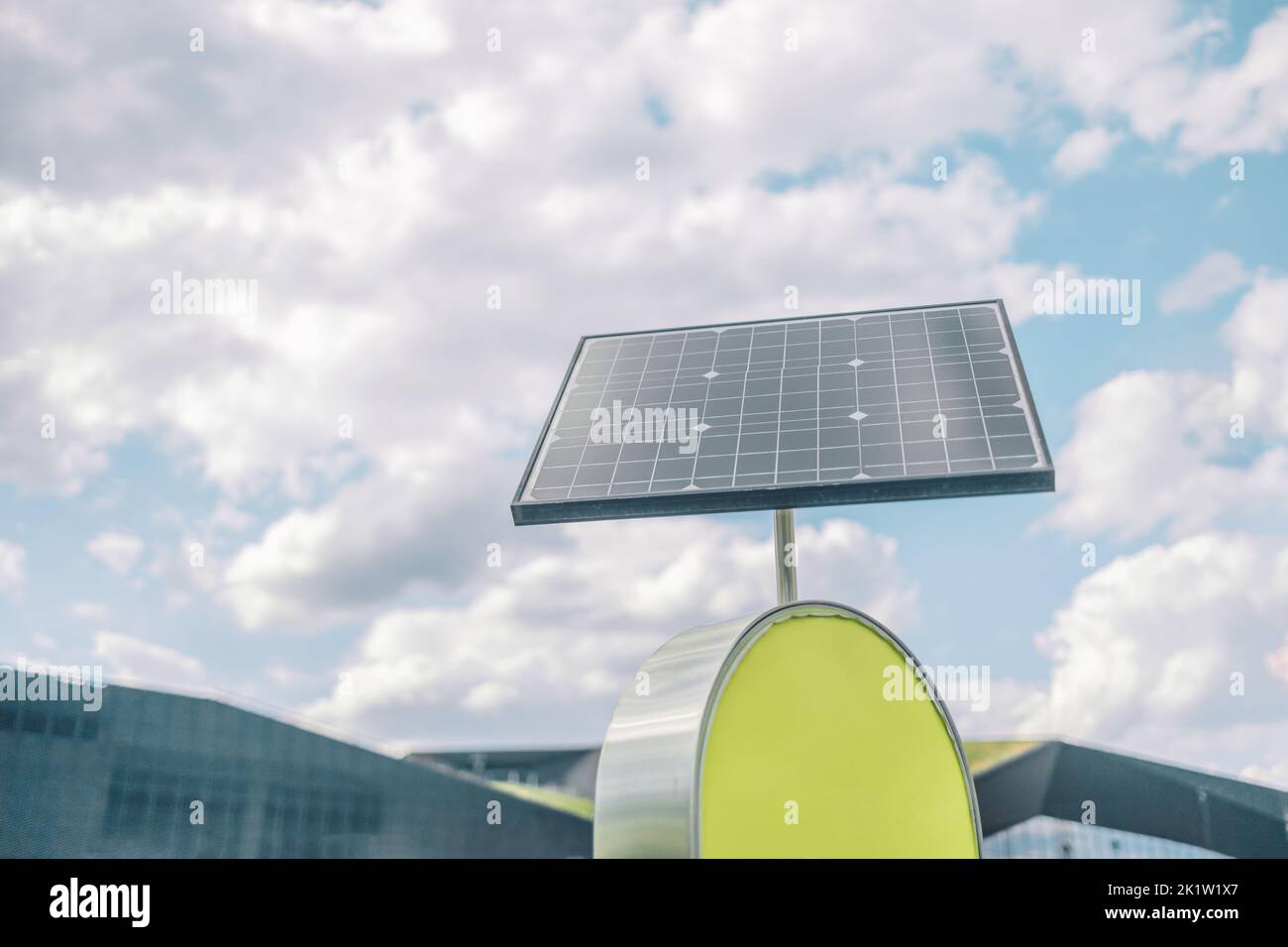 Photovoltaic solar panel against a blue sky with cloud. Alternative ...