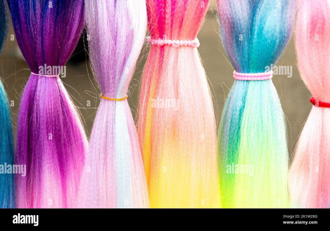 Colored synthetic hair. Strands of colorful artificial hair to attach ...