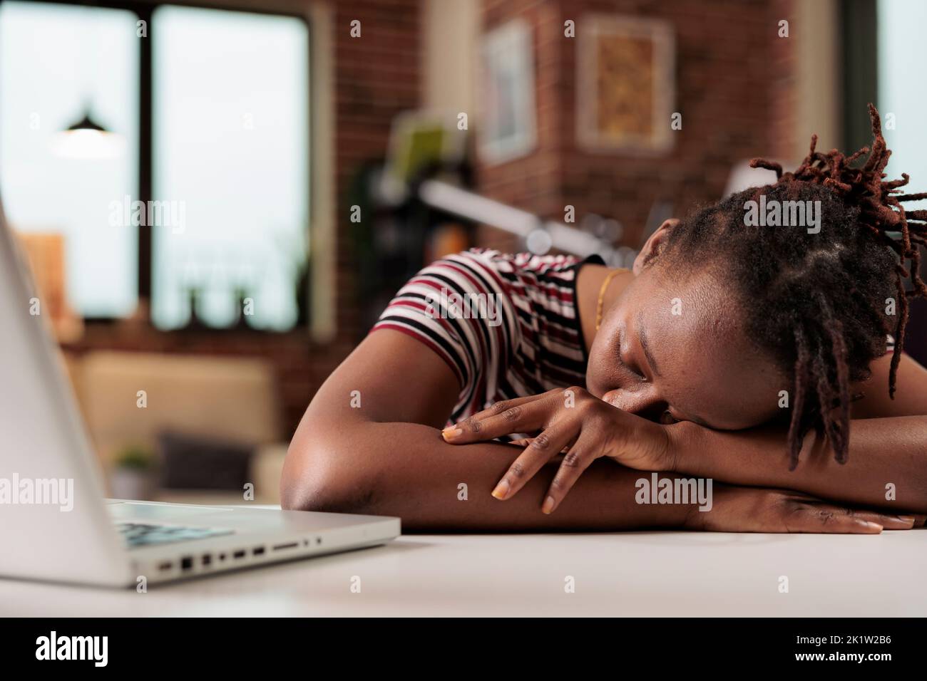 Overworked freelancer asleep on table at workplace, sleepy stressed ...