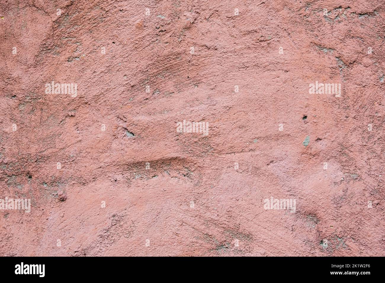 Dusty pink rose texture of concrete. An old concrete wall painted with ...