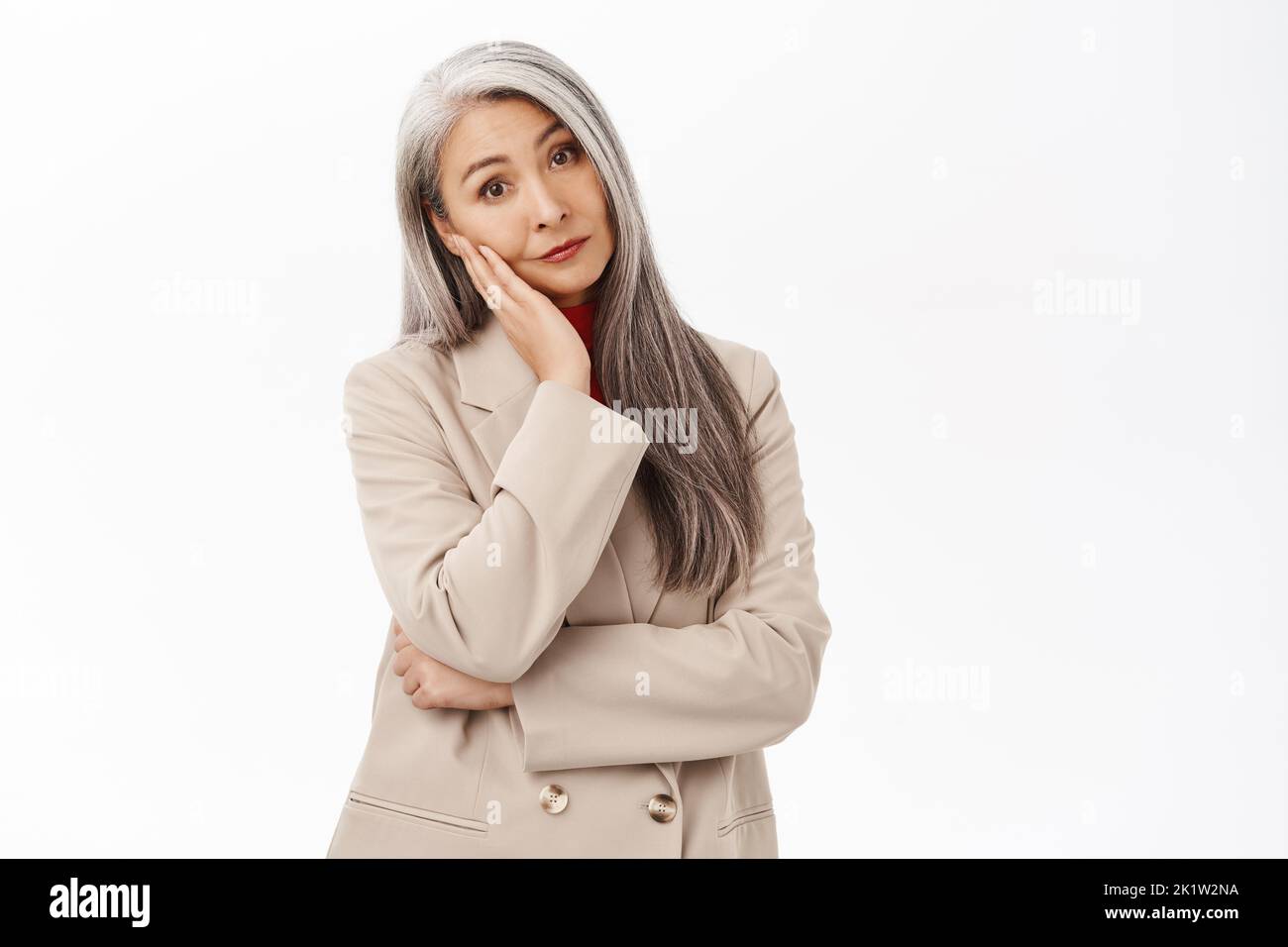 Portrait of stylish beautiful asian senior woman, lean head on hand ...