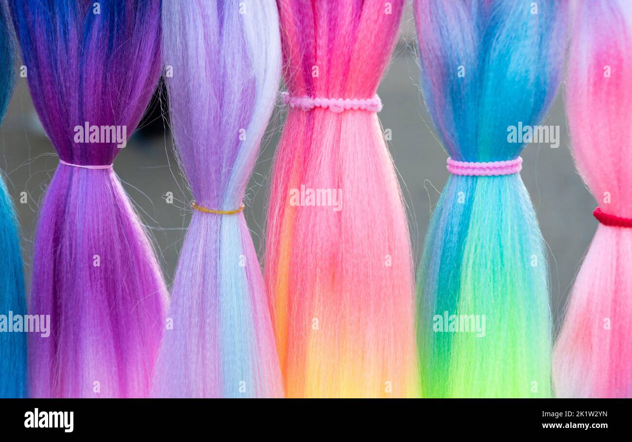 Colored synthetic hair. Strands of colorful artificial hair to attach ...
