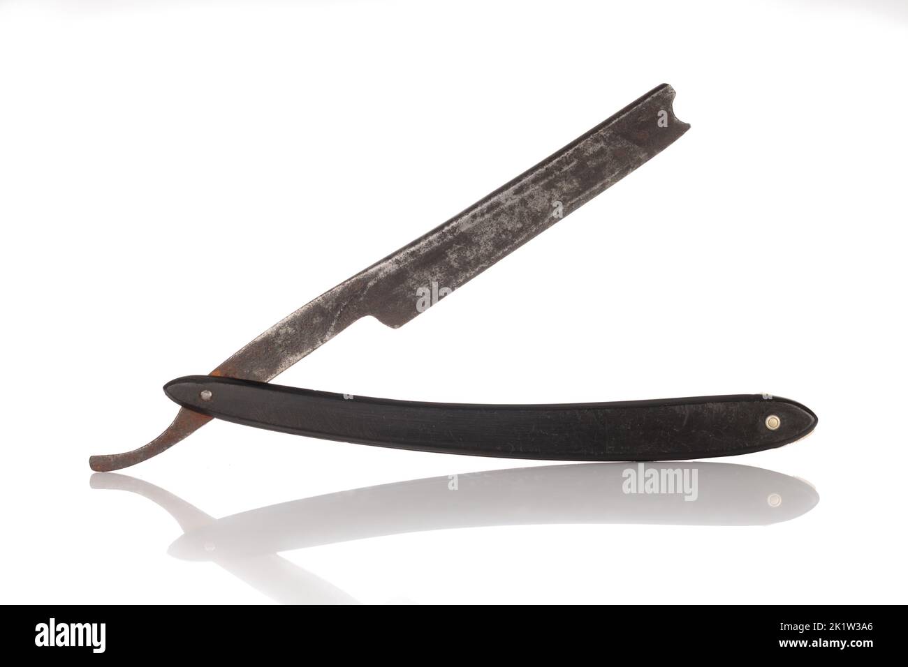 Old black razor, vintage shaving blade. Isolated on a white background ...
