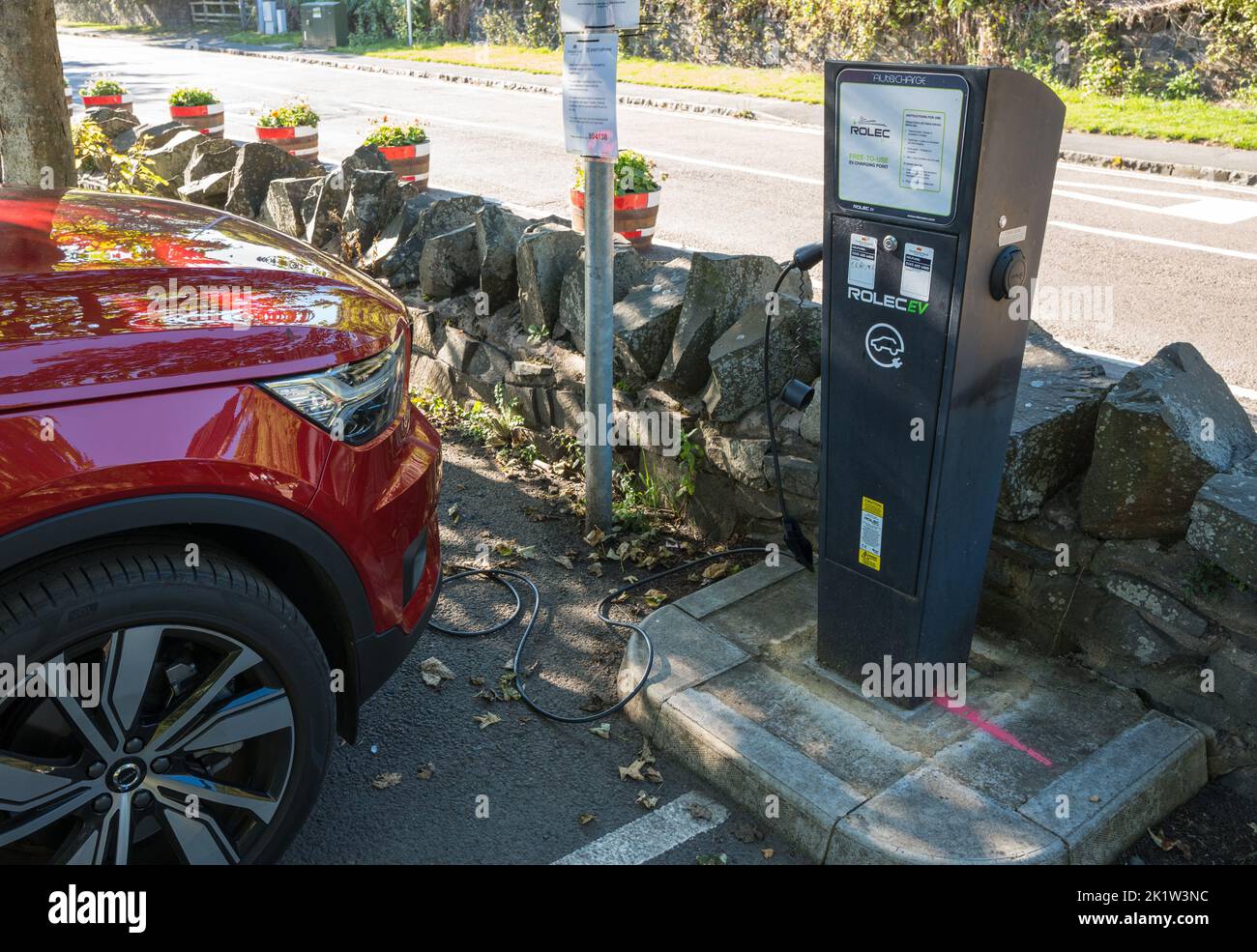 Electric car plugged into a Rolec free charging point at a carpark in ...