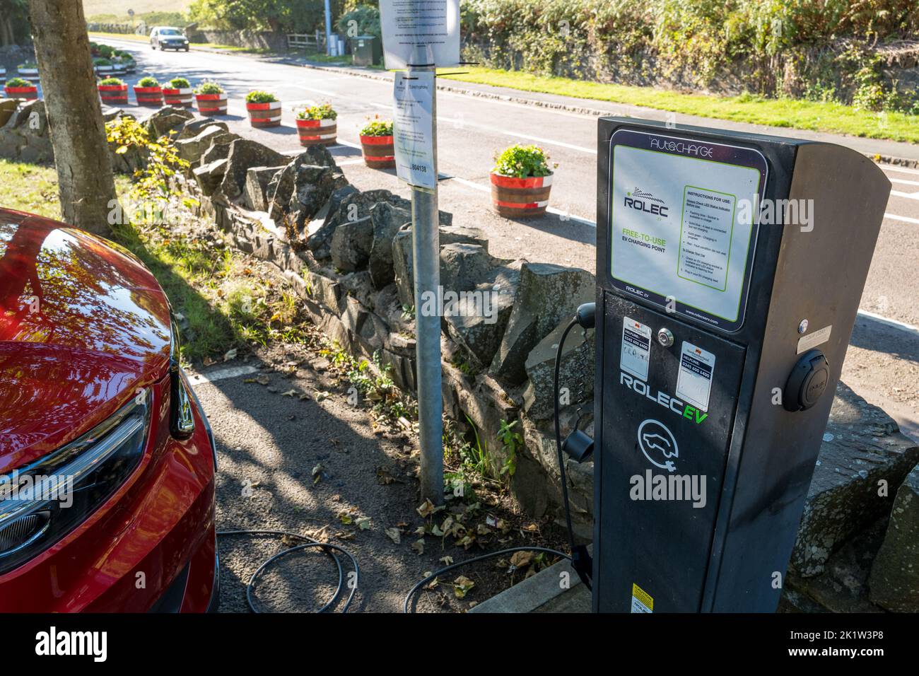 Electric car plugged into a Rolec free charging point at a carpark in ...