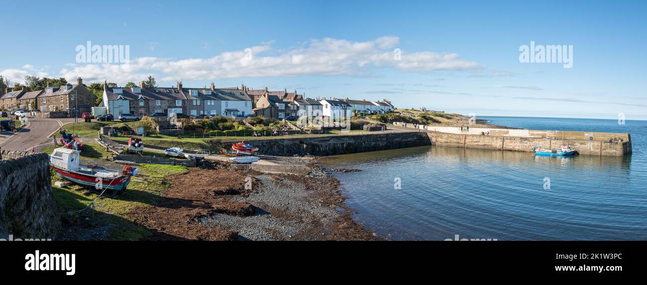The harbour in the small fishing village of Craster, Northumberland ...