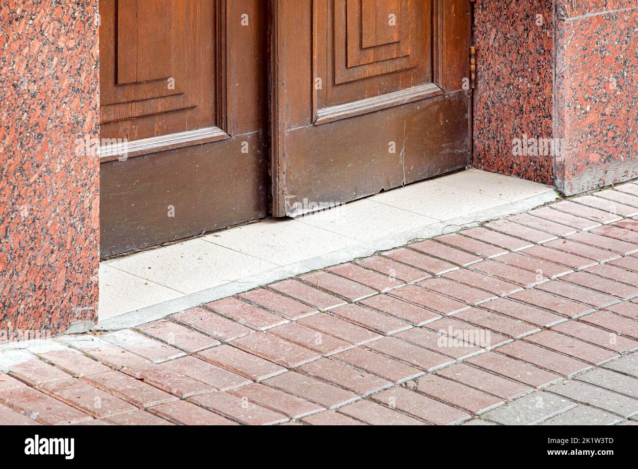 closed wooden entrance doors brown color with ceramic threshold ...
