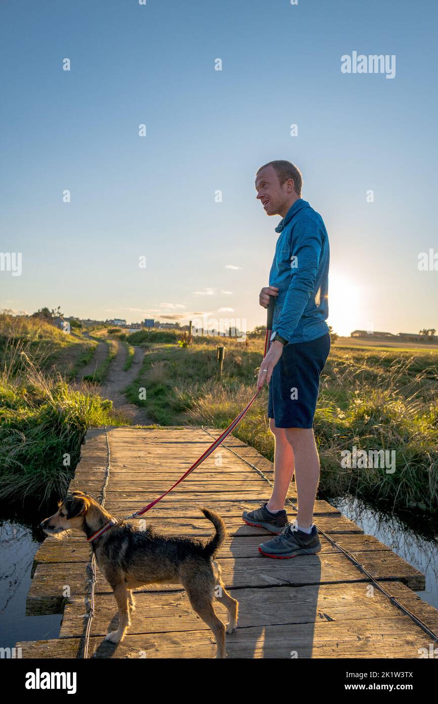 Dog and man shadow hi-res stock photography and images - Alamy