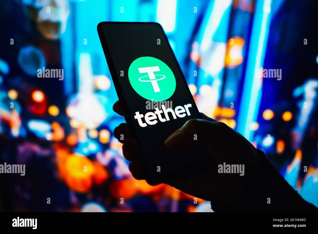 In this photo illustration, the Tether logo seen displayed on a ...