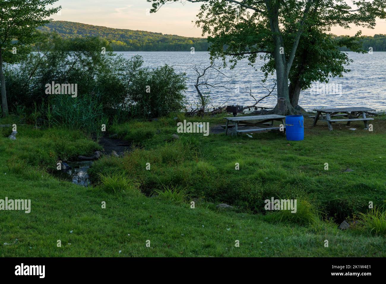 Blue plastic barrel for garbage in a park near Rockland Lake, New York ...