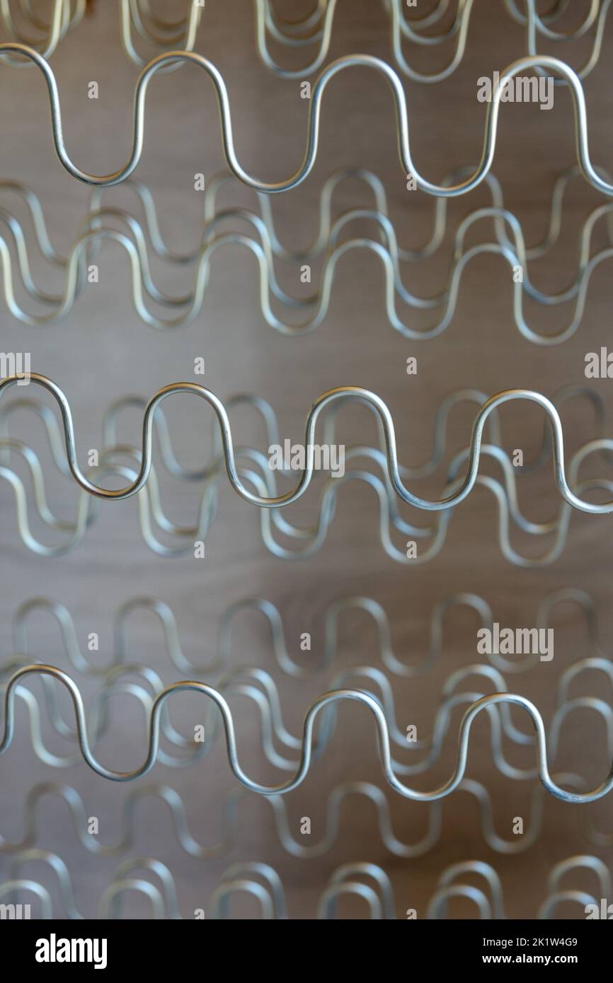 View of spring shock absorbers stretched on a frame inside a modern ...