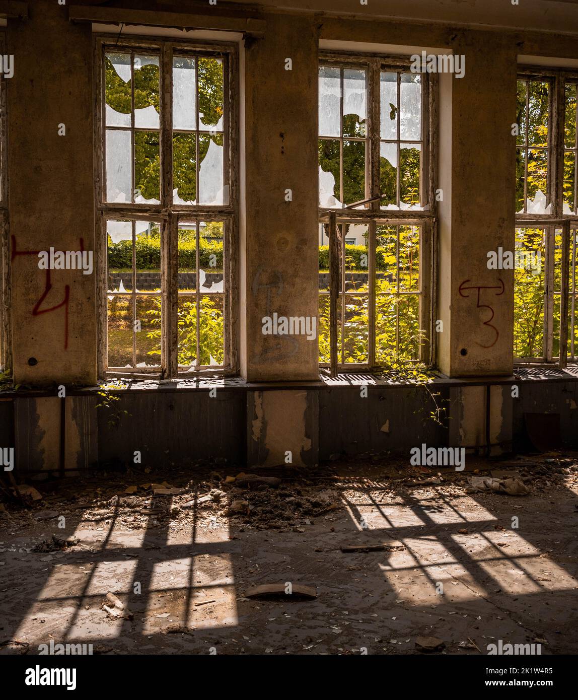 An indoor view of abandoned building witgh broken glass windows Stock ...