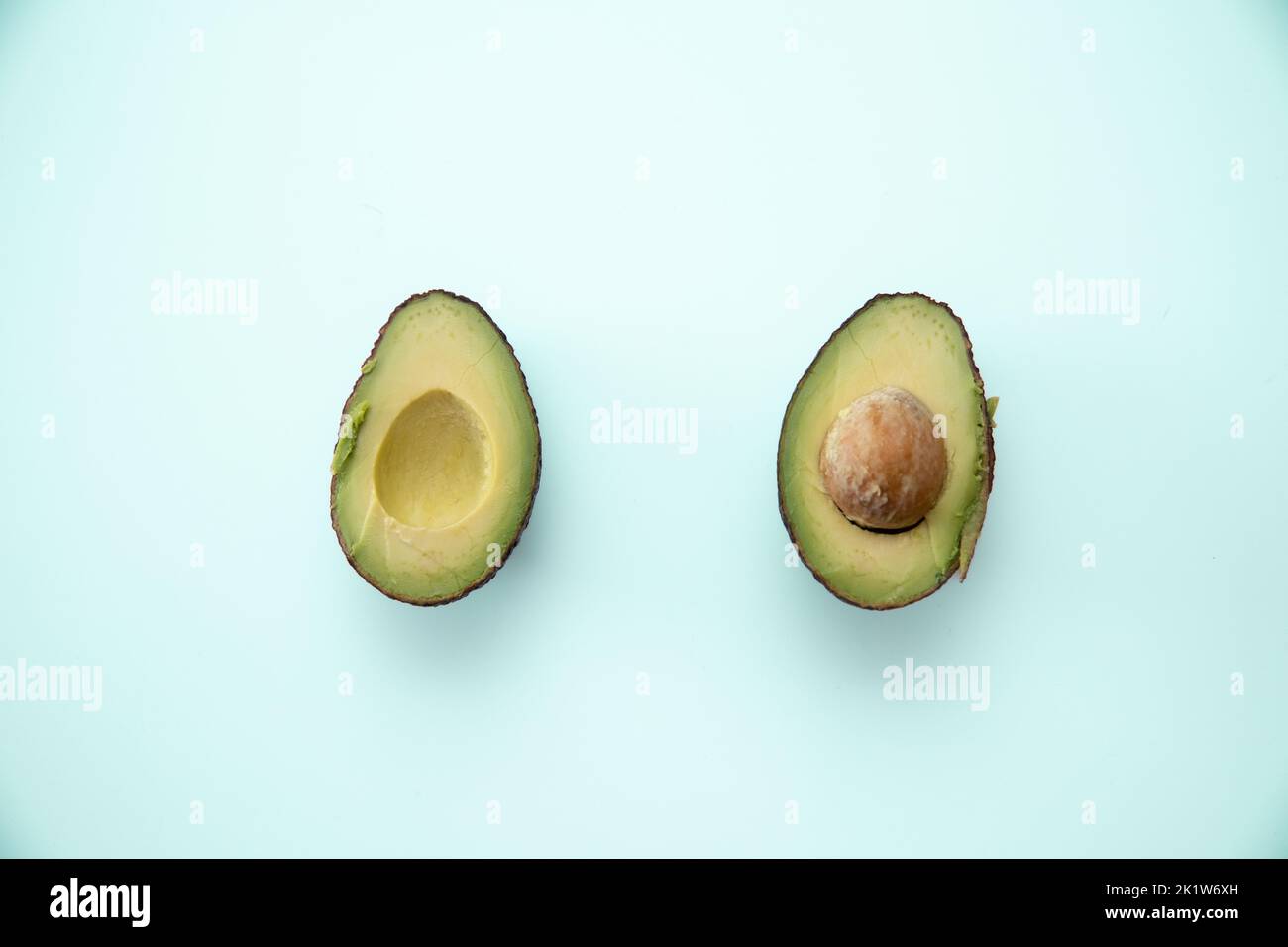 A top view of two pieces of avocado Stock Photo - Alamy