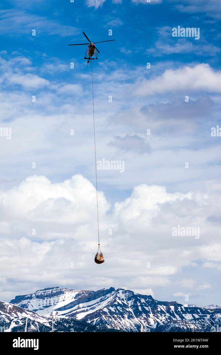 Helicopter flies in seasonal supplies to the Lake Agnes Tea House; Lake ...