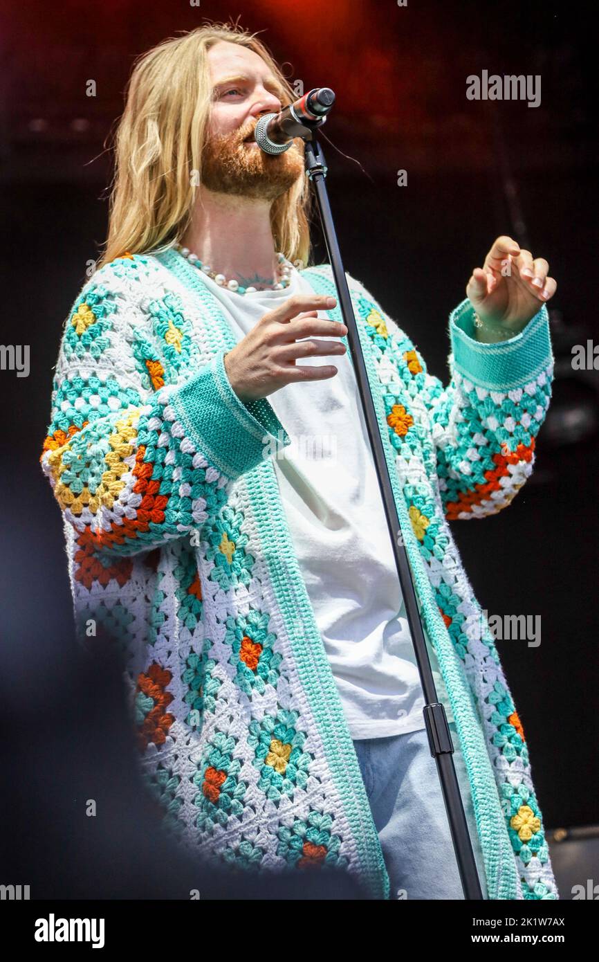 A vertical shot of the singer Sam Ryder during his performance at ...