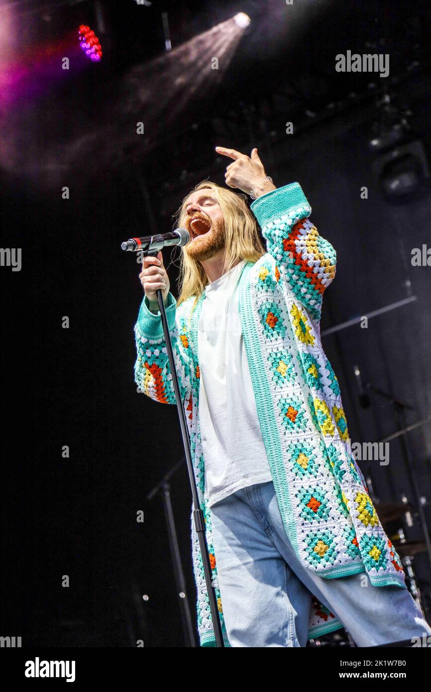 A vertical shot of the singer Sam Ryder during his performance at ...