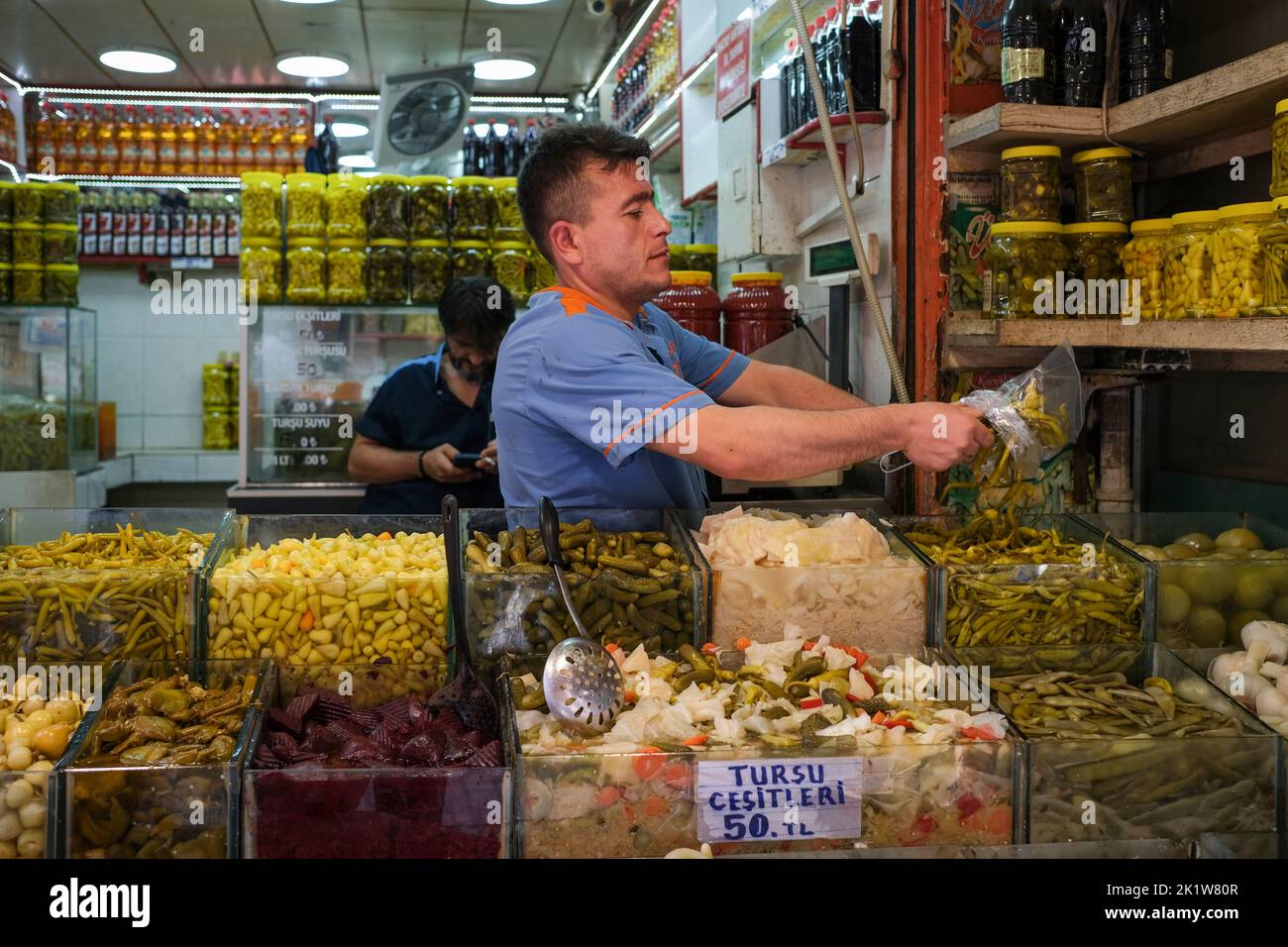 Istanbul, Turkey. 18th Sep, 2022. A pickle vendor packs pickles for his ...