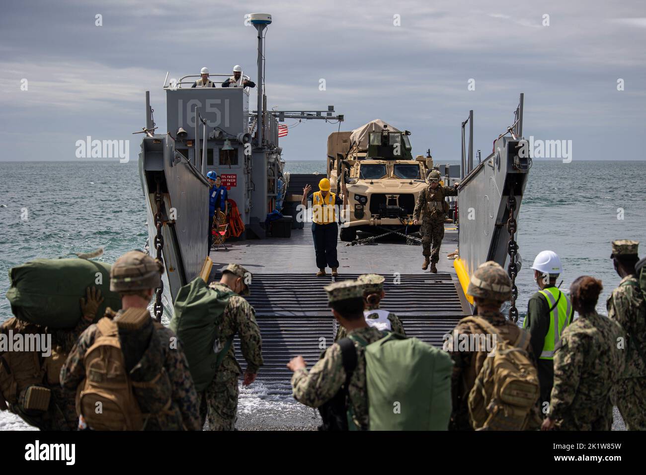 A U.S. Sailor assigned to Landing Craft Utility (LCU) 1651 with Naval ...